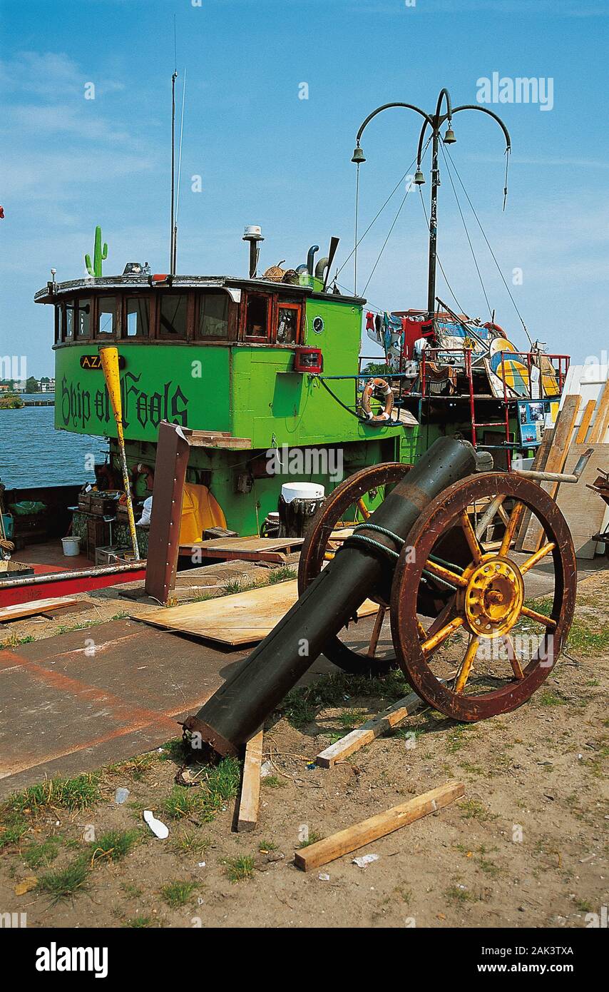 An old cargo ship, used as an alternative accommodation, anchoring at a ...