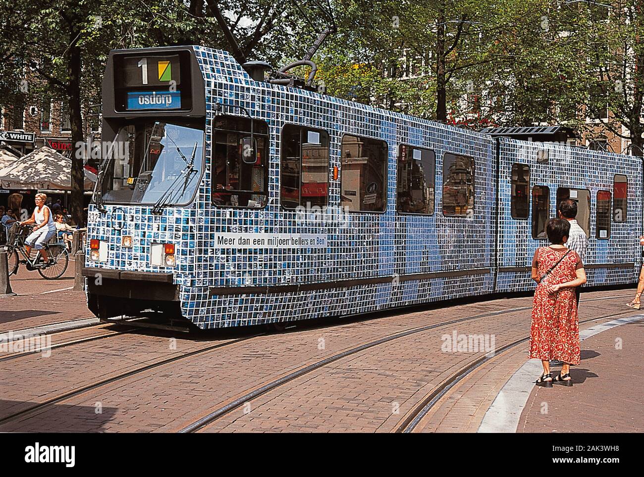 A streetcar in the city center of Amsterdam. The streetcar is a popular ...