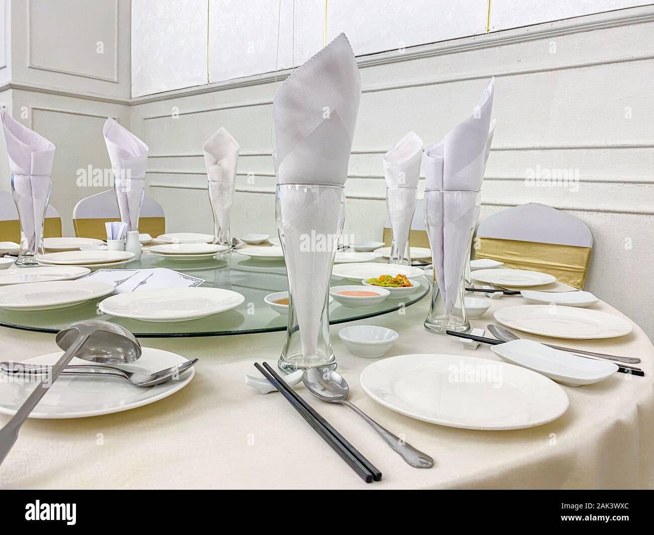 Dinner banquet table setting and elegant tableware in wedding hall ...