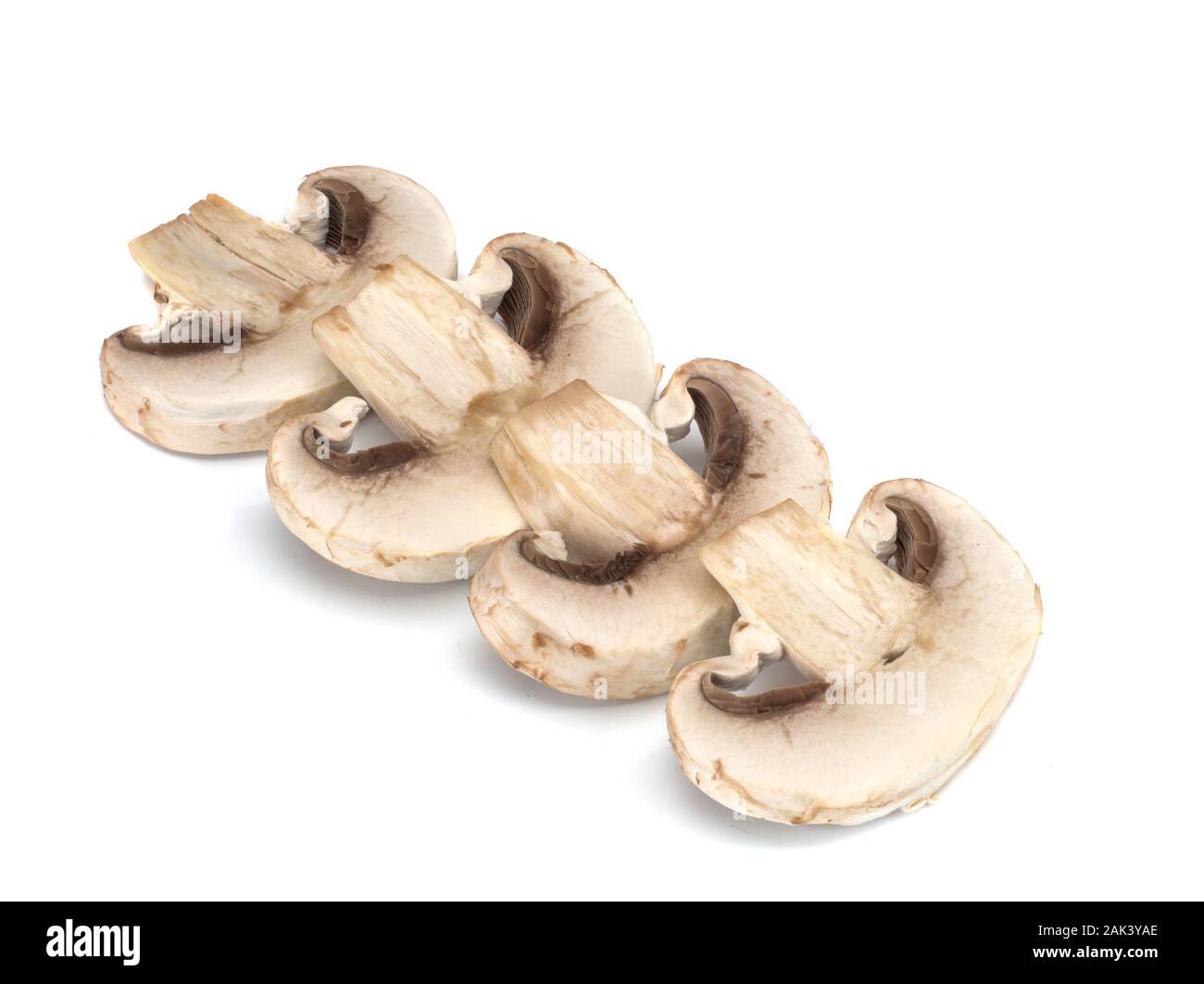 Champignon slices on a white background Stock Photo - Alamy