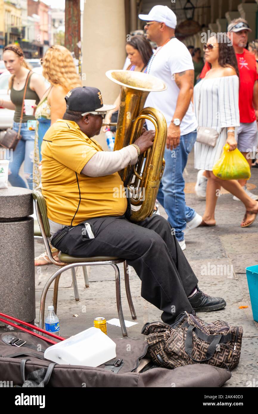 male street performer in cap playing Tuba in a New Orleans street Stock ...