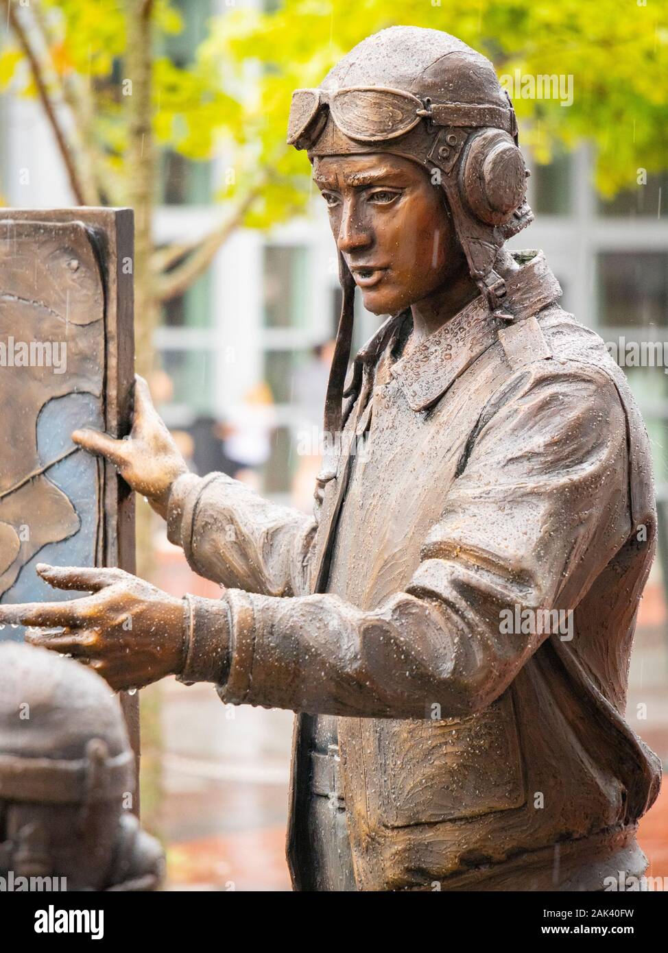 bronze statue of a group of military pilots during a mission briefing ...