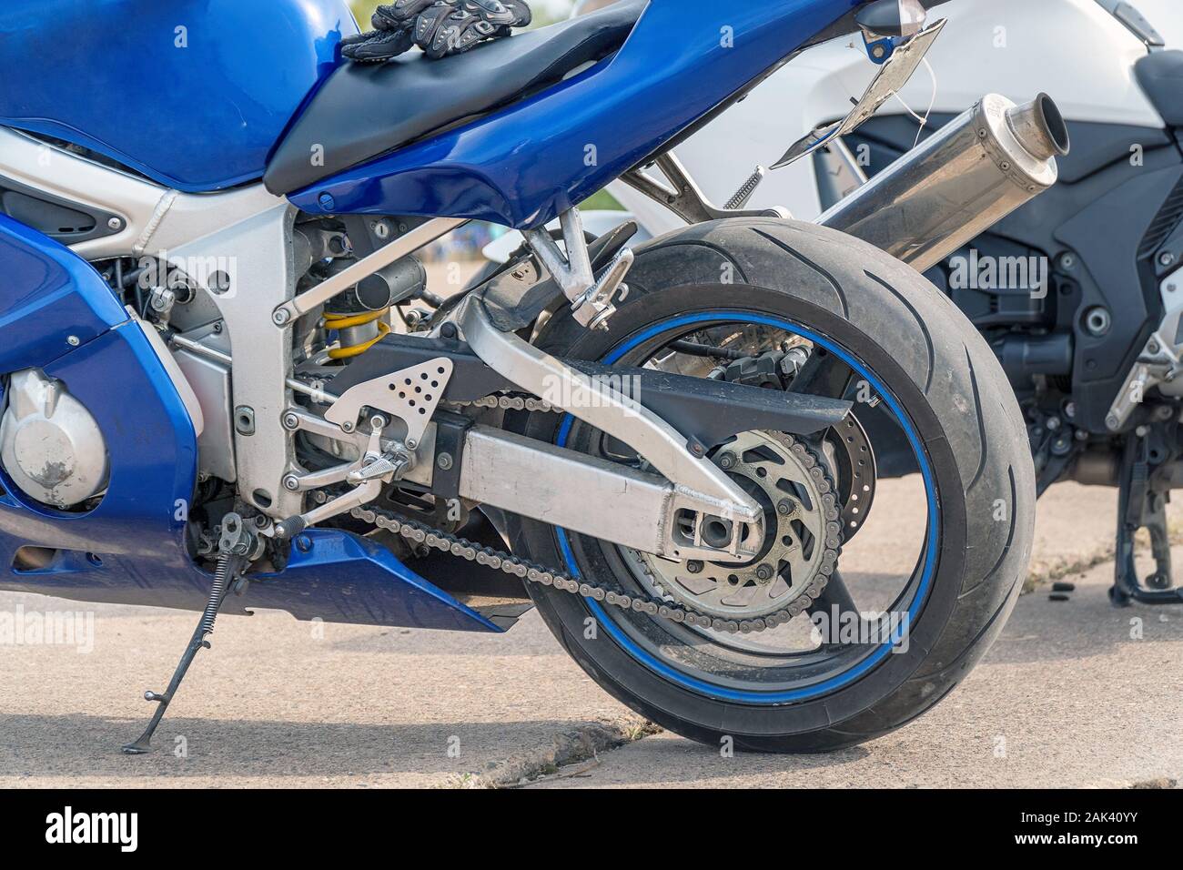 View of the rear wheel of a blue road bike Stock Photo - Alamy