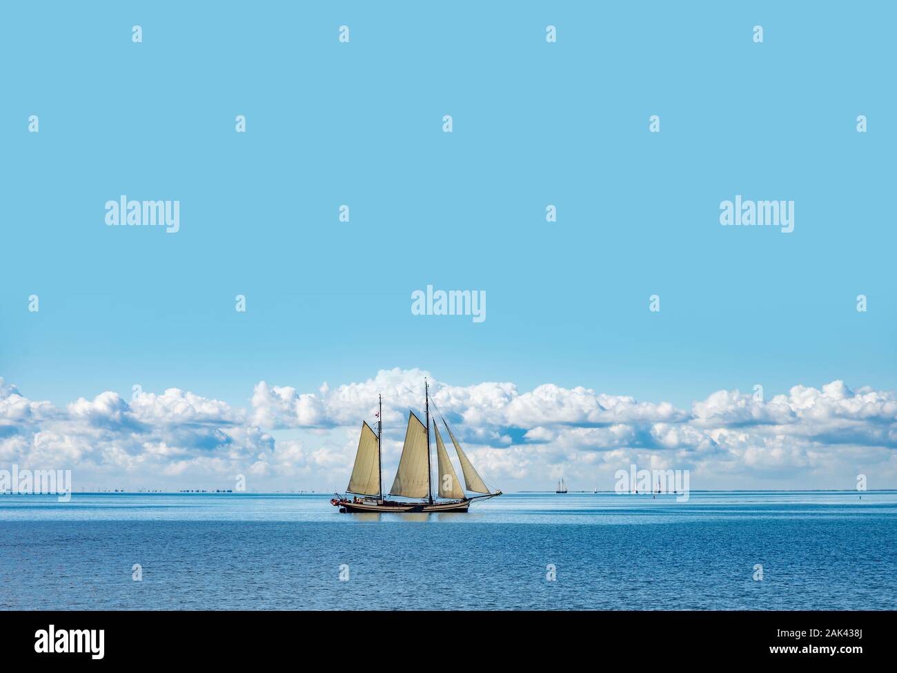 Sailboat on the waves Stock Photo - Alamy