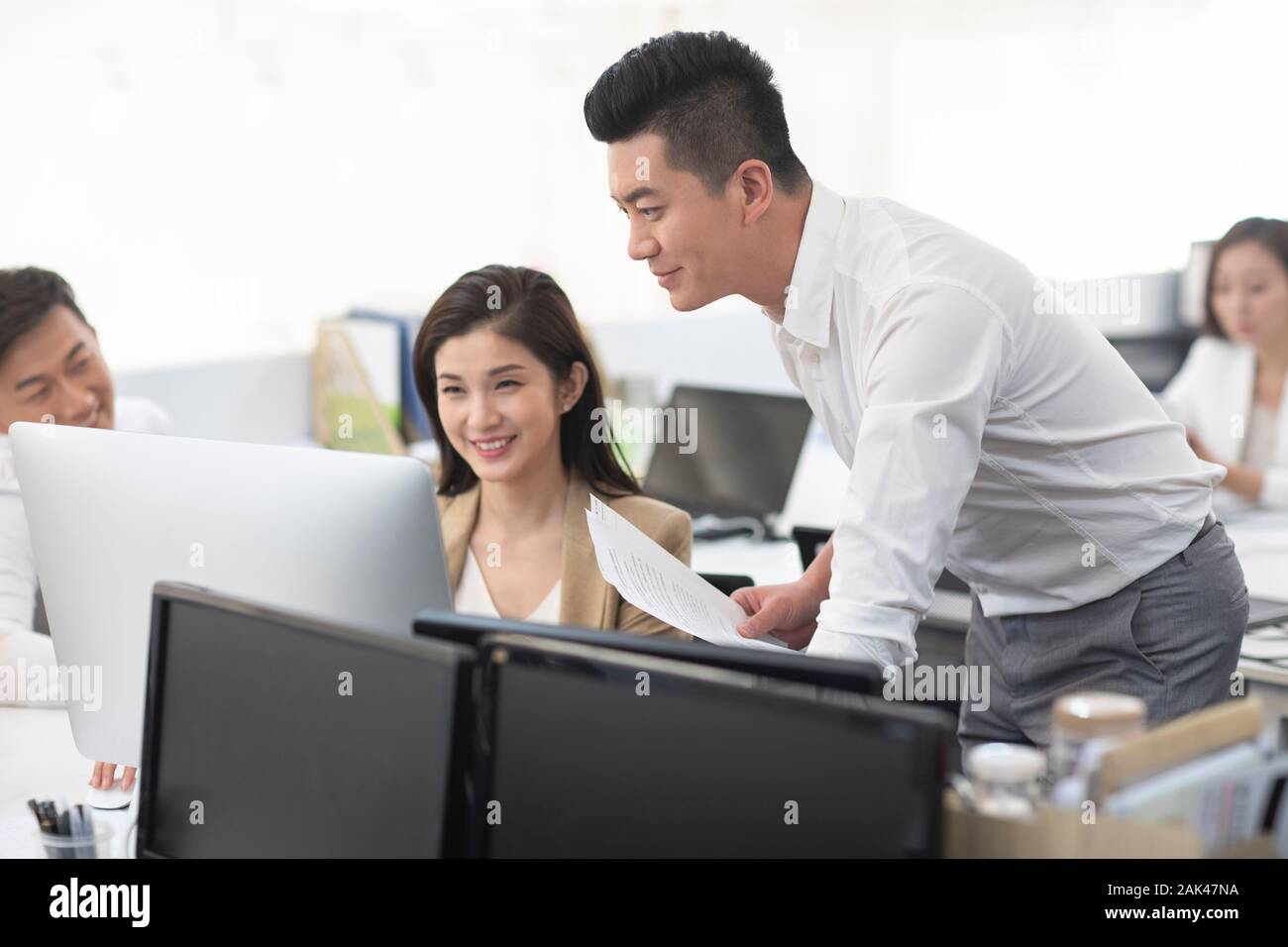 Chinese business people working in office Stock Photo - Alamy