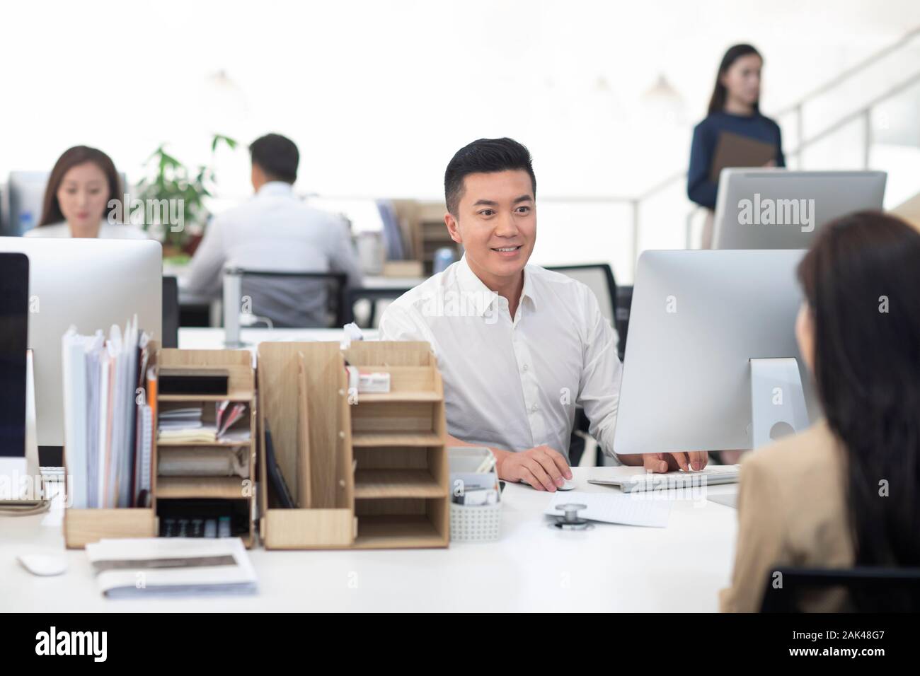 Chinese business people working in office Stock Photo - Alamy