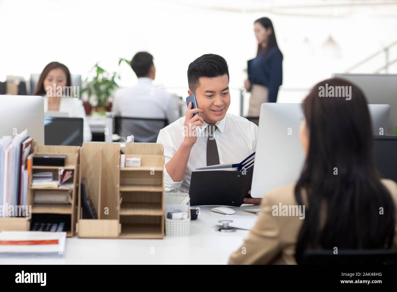 Chinese business people working in office Stock Photo - Alamy