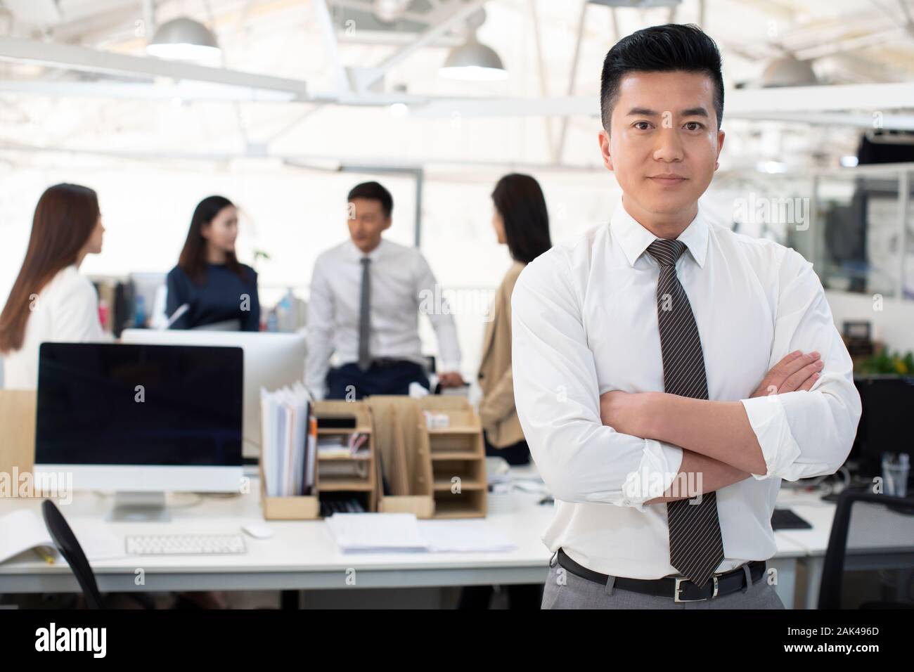 Chinese business people working in office Stock Photo - Alamy