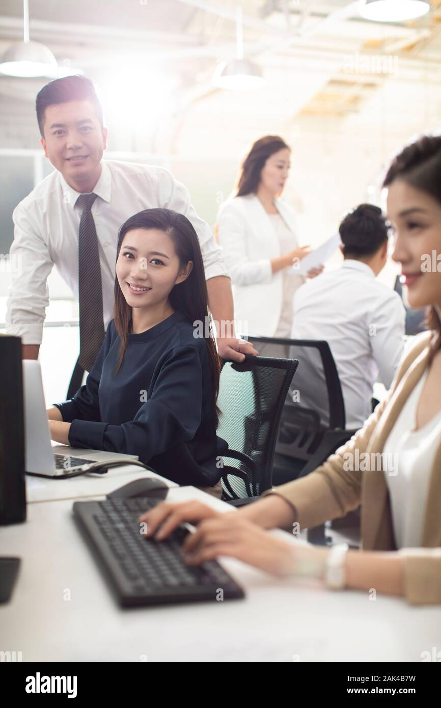 Chinese business people working in office Stock Photo - Alamy