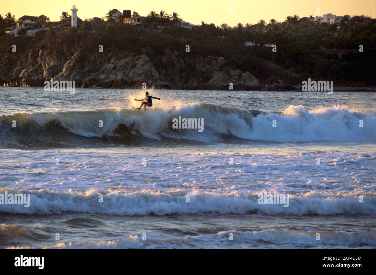 Mexico: surfer in the surf | usage worldwide Stock Photo - Alamy