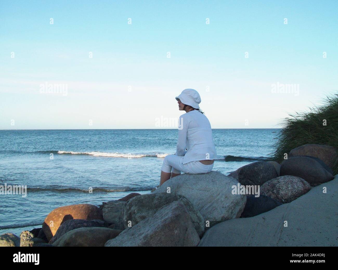 Girl on a rock Stock Photo - Alamy