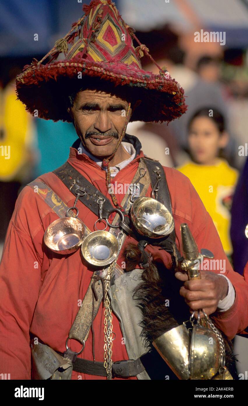 Morocco: Meknès - Man Selling Water on the Place el Hédim | usage ...