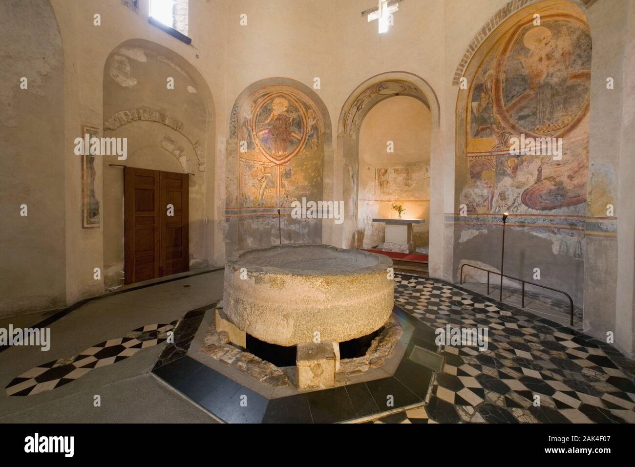 View of the baptismal font, the apsis and fresco alcoves in the ...