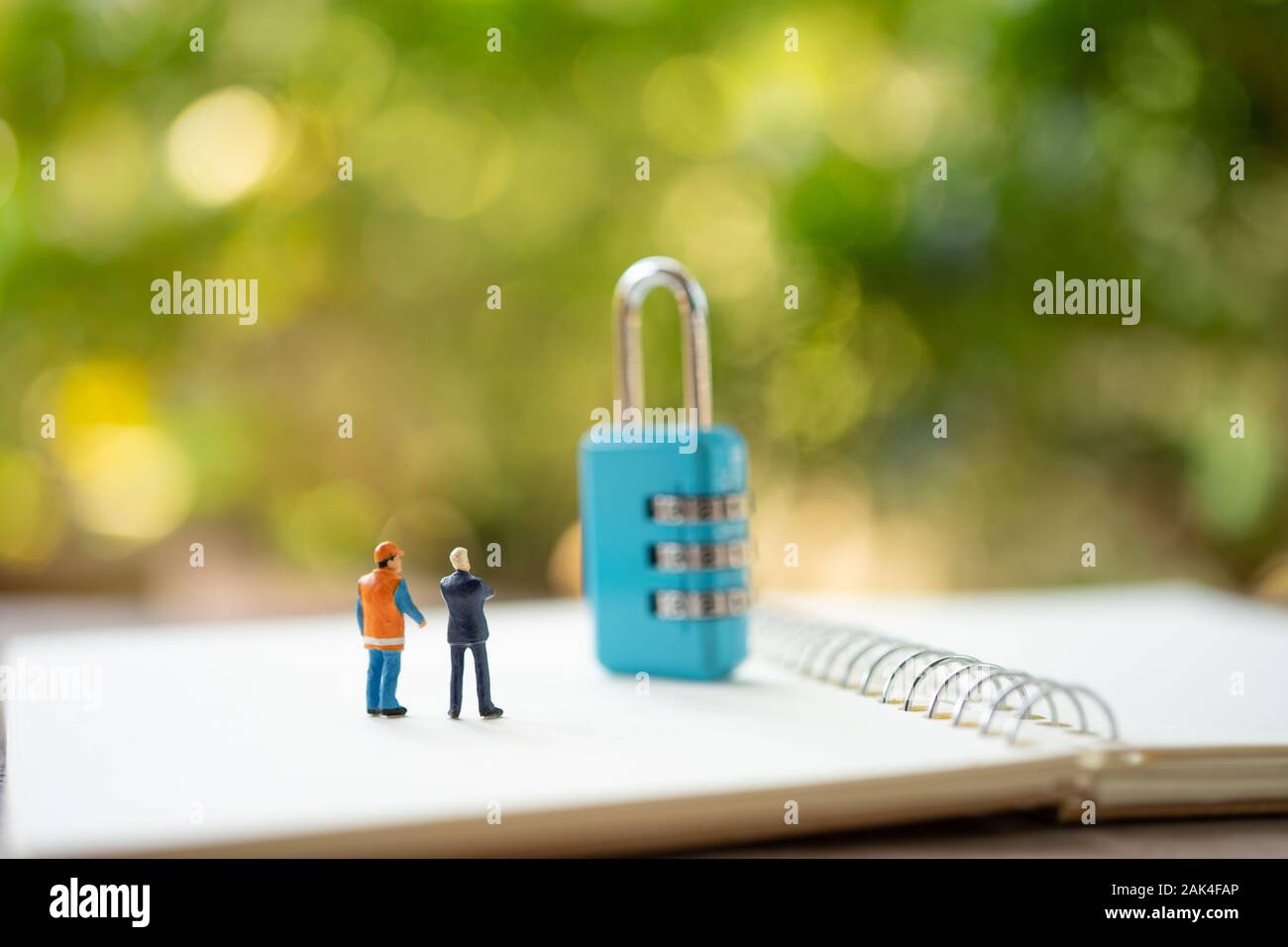 Miniature people Construction worker Security Key Repair And the ...