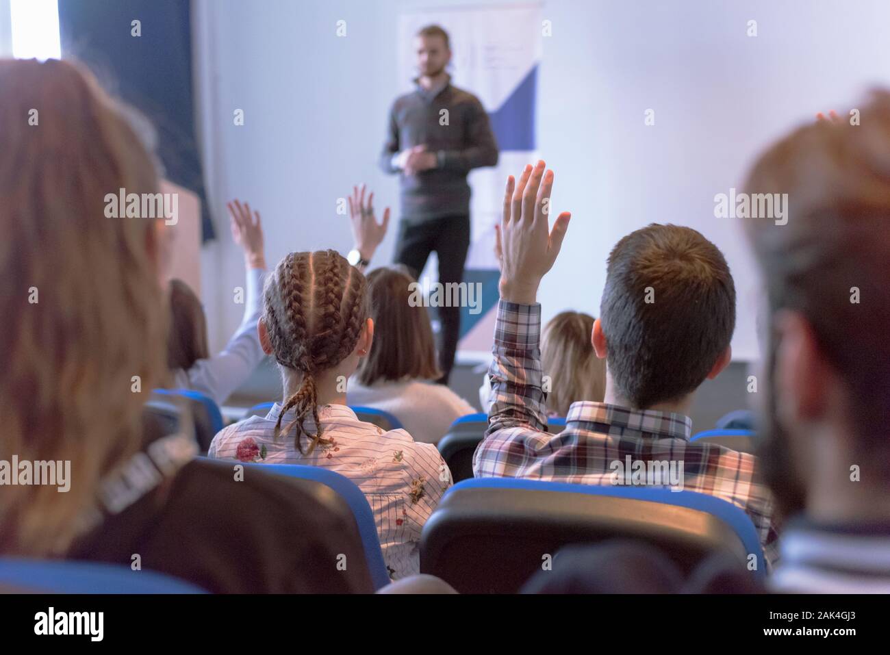 Education process at professor`s lecture in audience. Young male ...