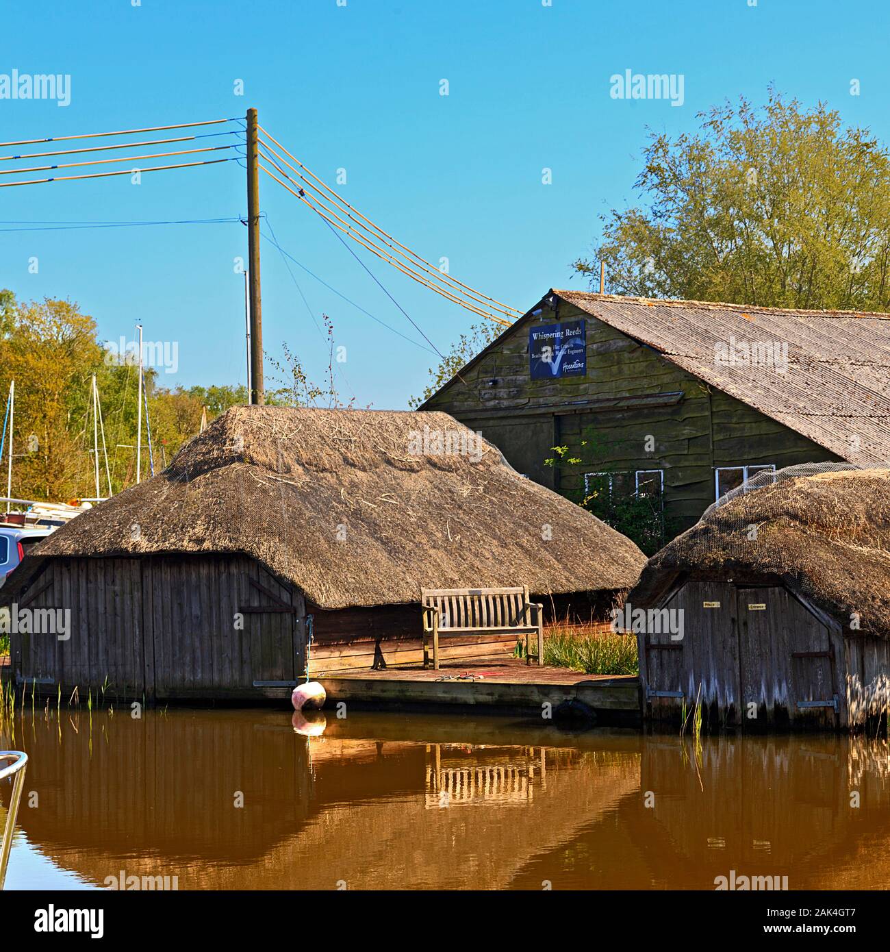 Thatched boathouses on Hickling Broad on the Norfolk Broads, England ...
