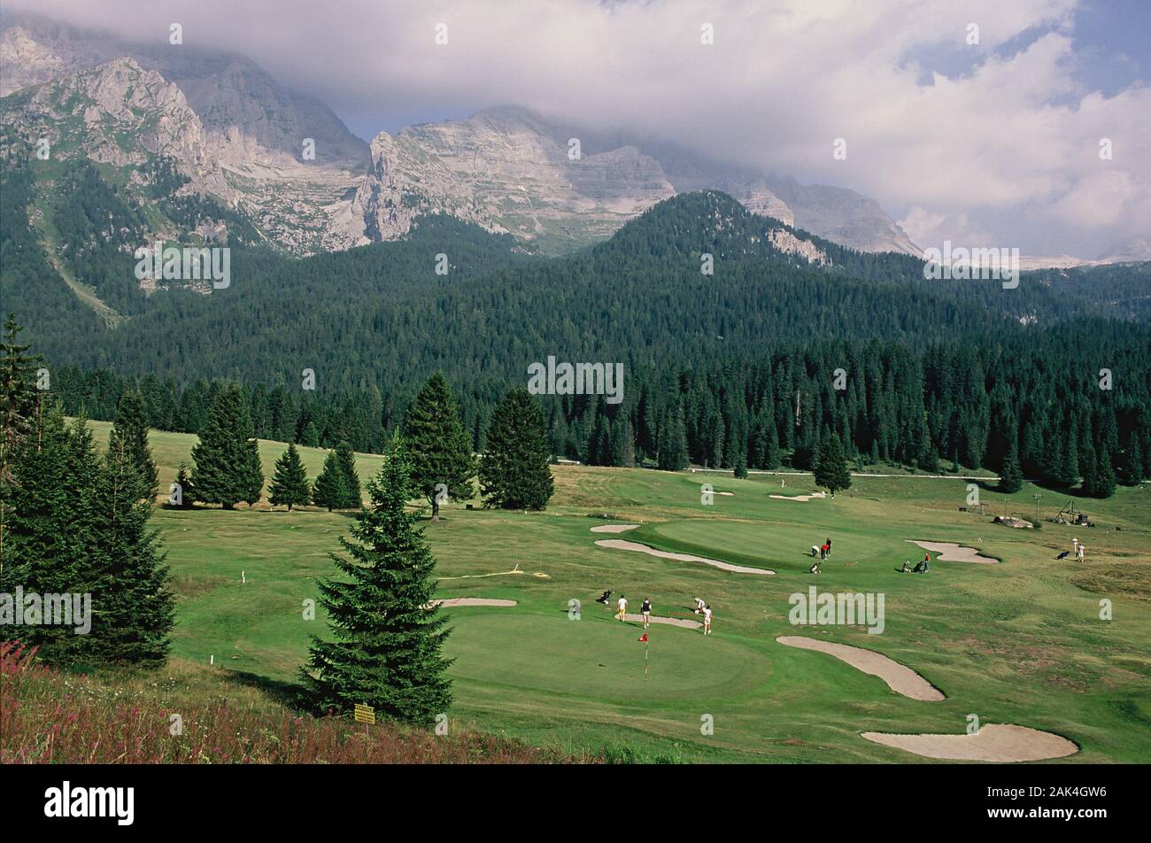 A large golf curse is situated between the high mountains in Madonna di ...