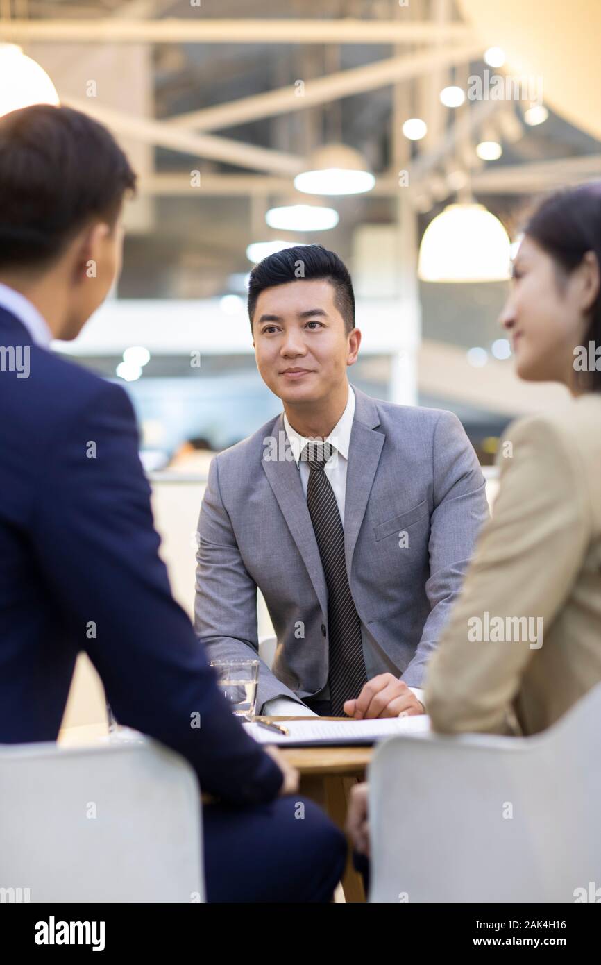 Chinese business people having a meeting in office Stock Photo - Alamy