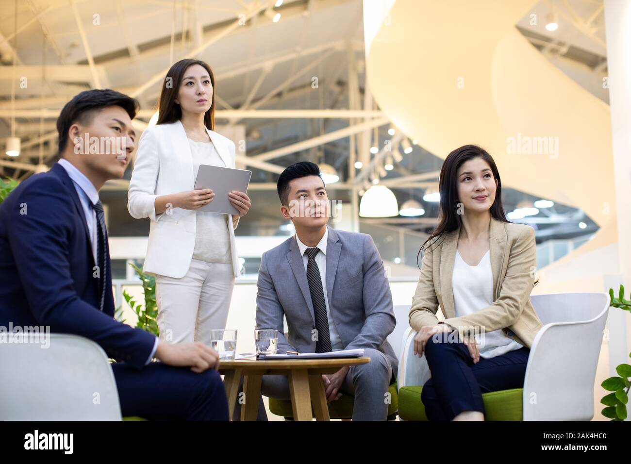Chinese business people having a meeting in office Stock Photo - Alamy