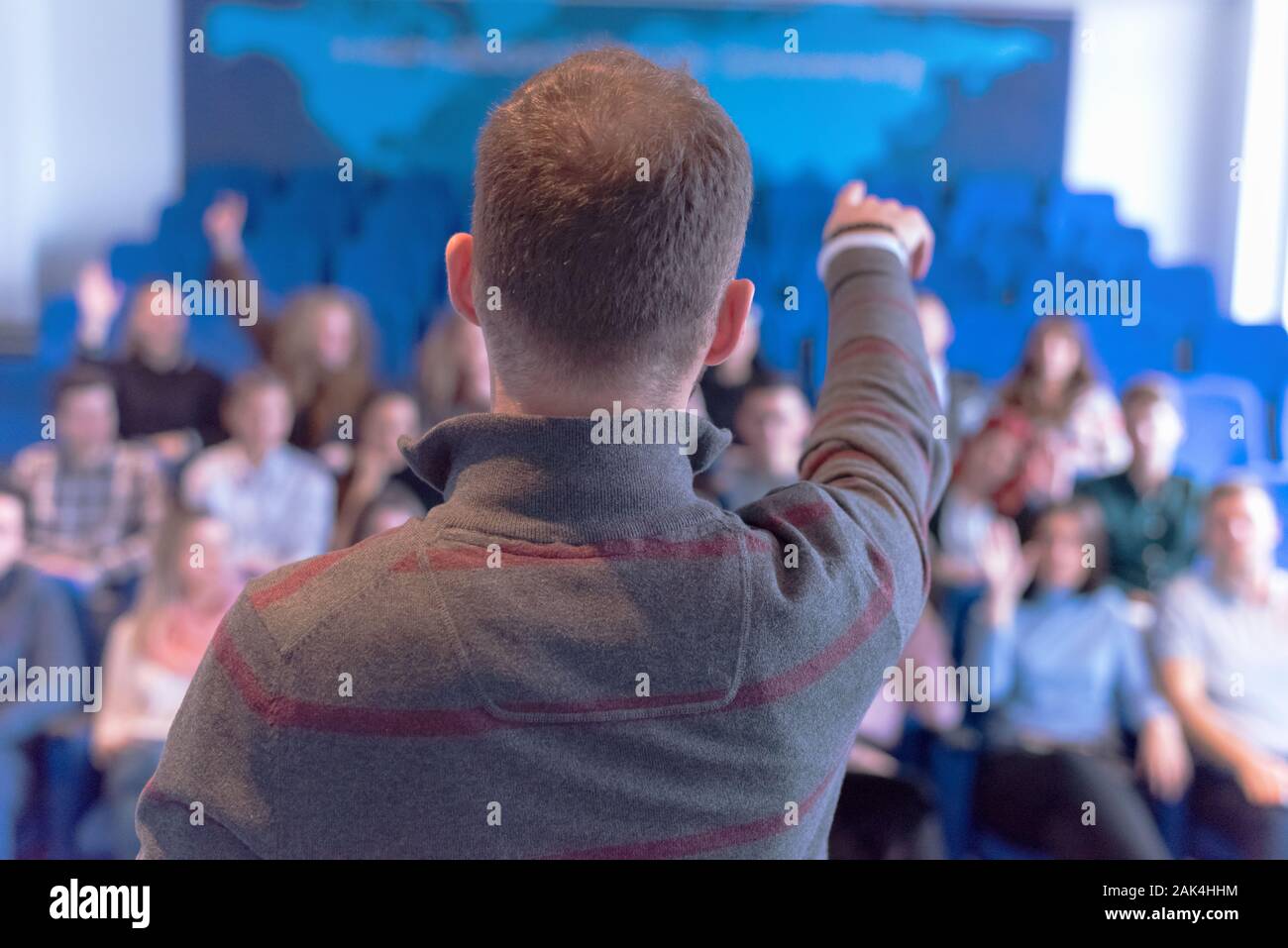 Education process at professor`s lecture in audience. Young male ...