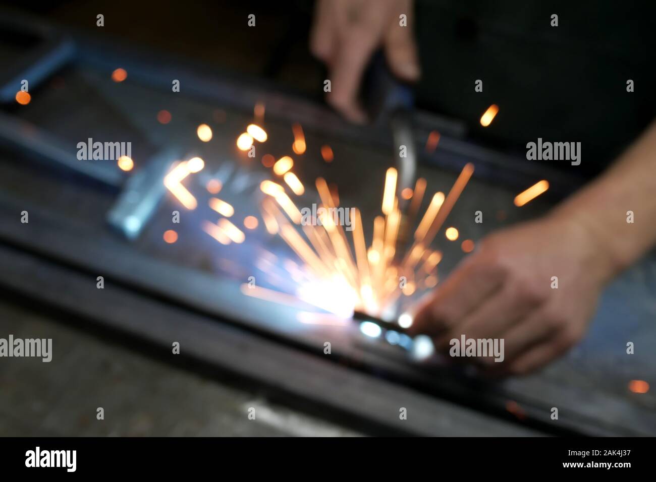 The welder cooks the frame. The welder cooks the metal. The welder ...
