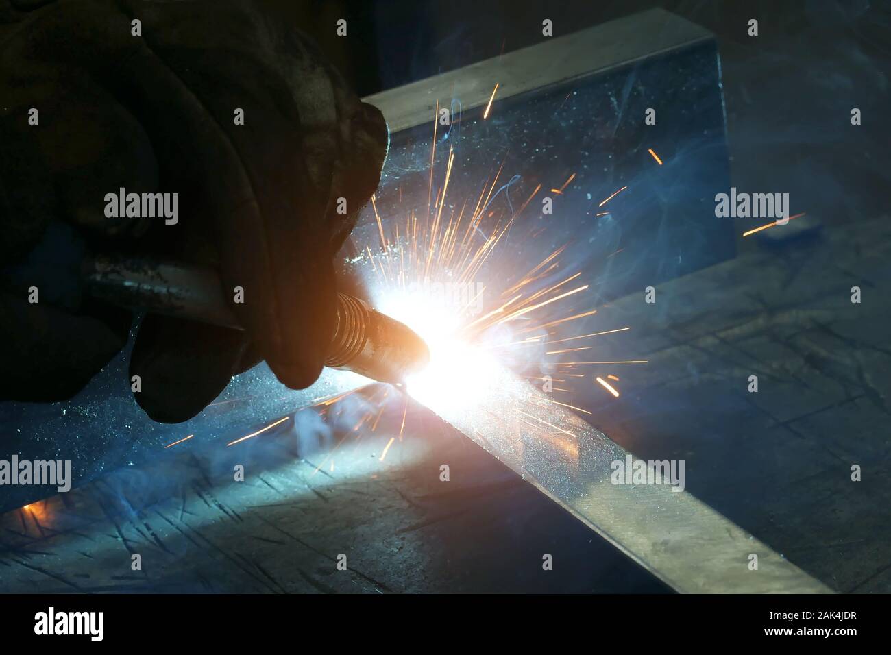 The welder cooks the frame. The welder cooks the metal. The welder ...