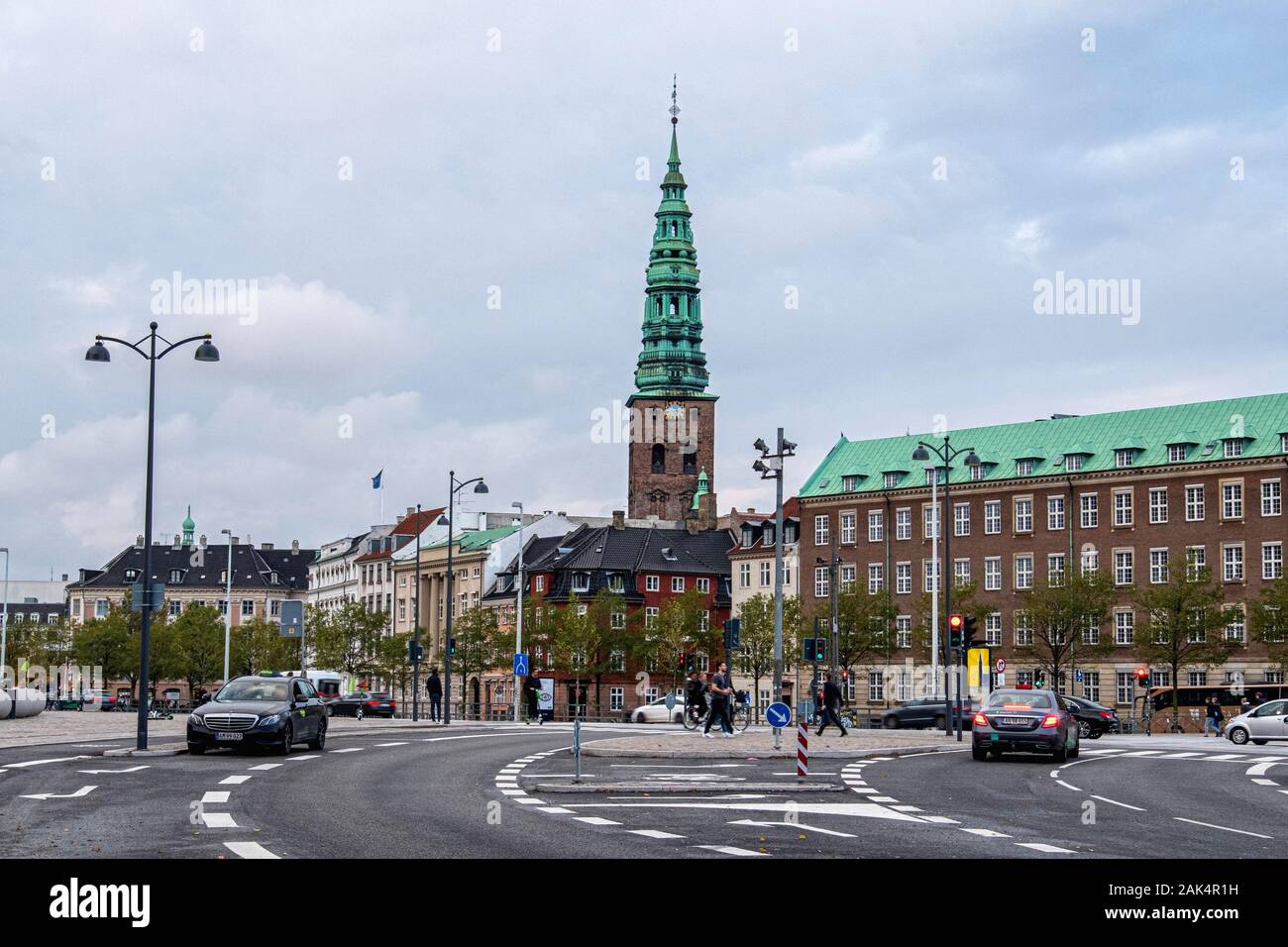 City view of historic old buildings and green church spire of the ...