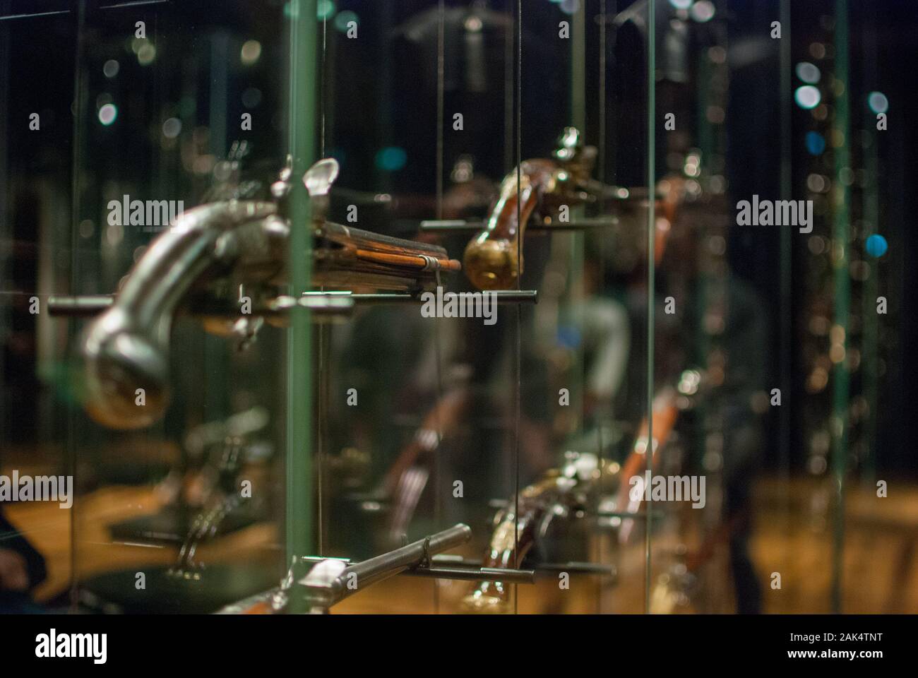 Old gun displayed in the window of a museum Stock Photo - Alamy