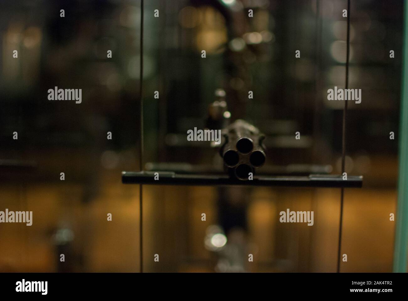 Old gun displayed in the window of a museum Stock Photo - Alamy
