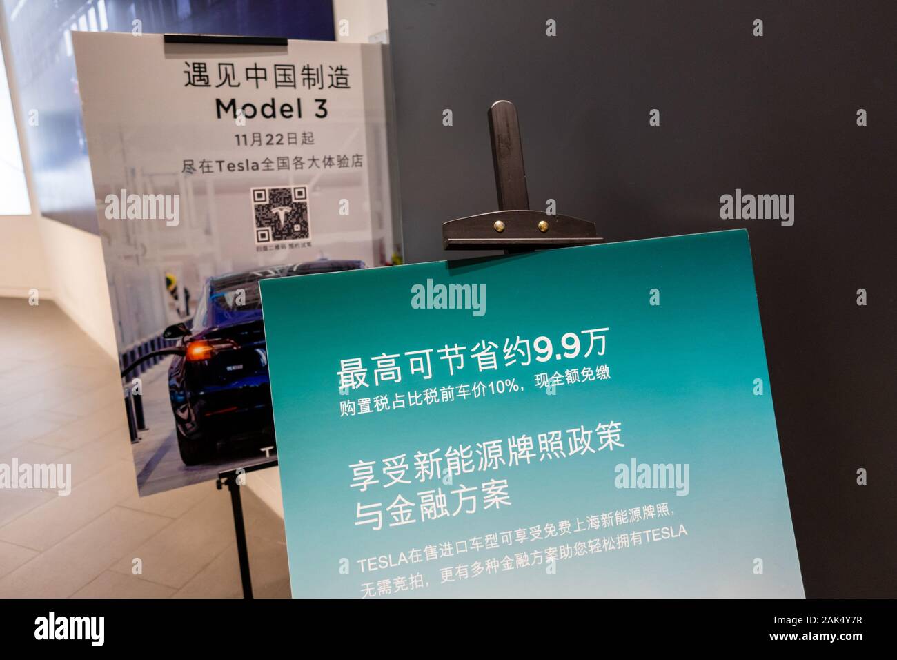 An advertising poster for the domestically-manufactured Tesla Model 3 ...