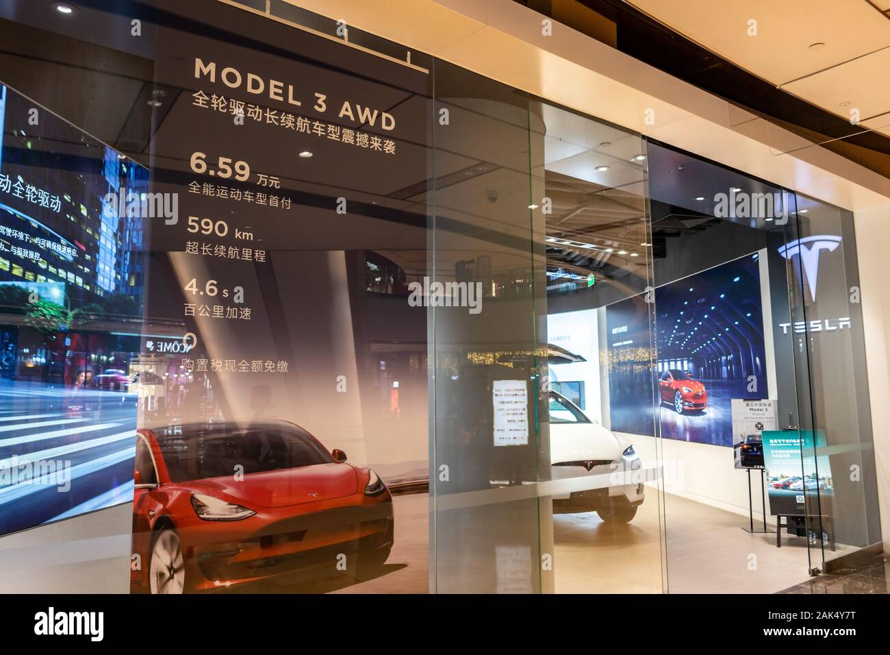 An advertising poster for the domestically-manufactured Tesla Model 3 ...