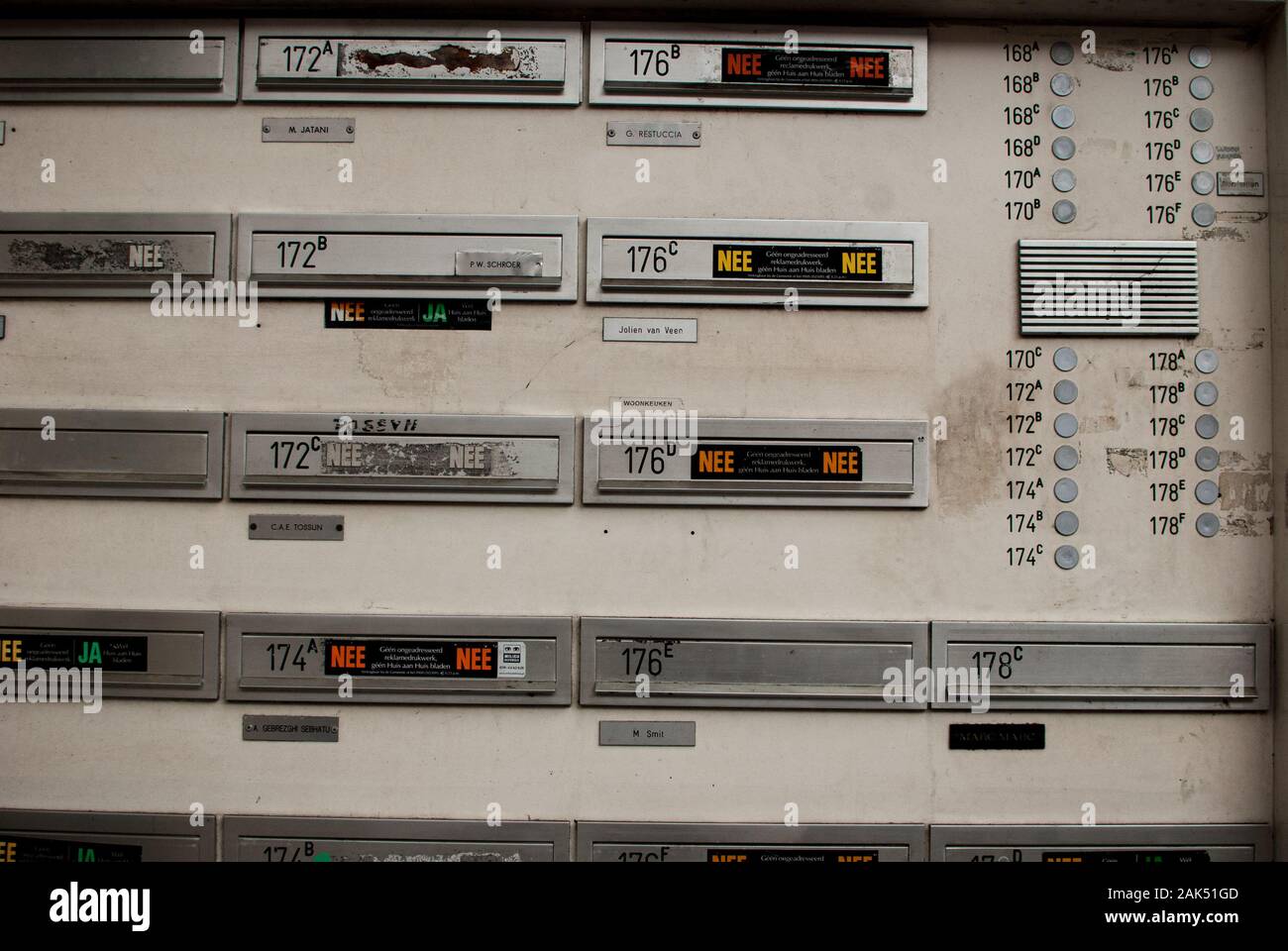 Mail panel and doorbell at the entrance of a building Stock Photo - Alamy