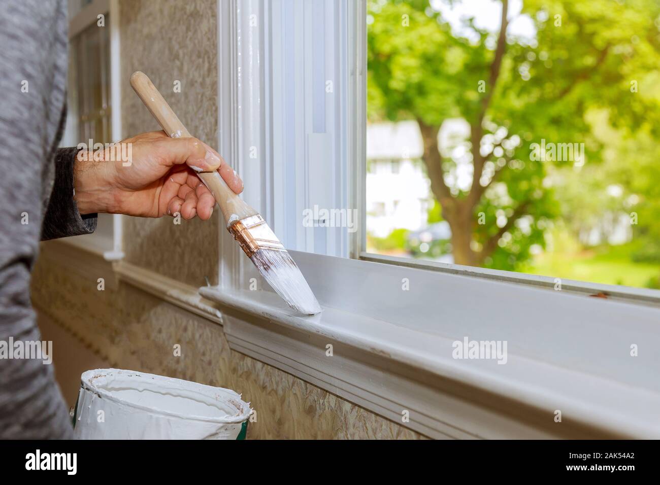 Painting a window sill hi-res stock photography and images - Alamy