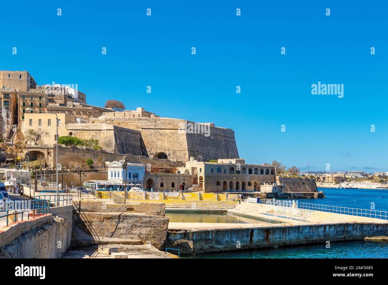 Ancient fortifications of Valletta and outdoor pool, medieval castle ...
