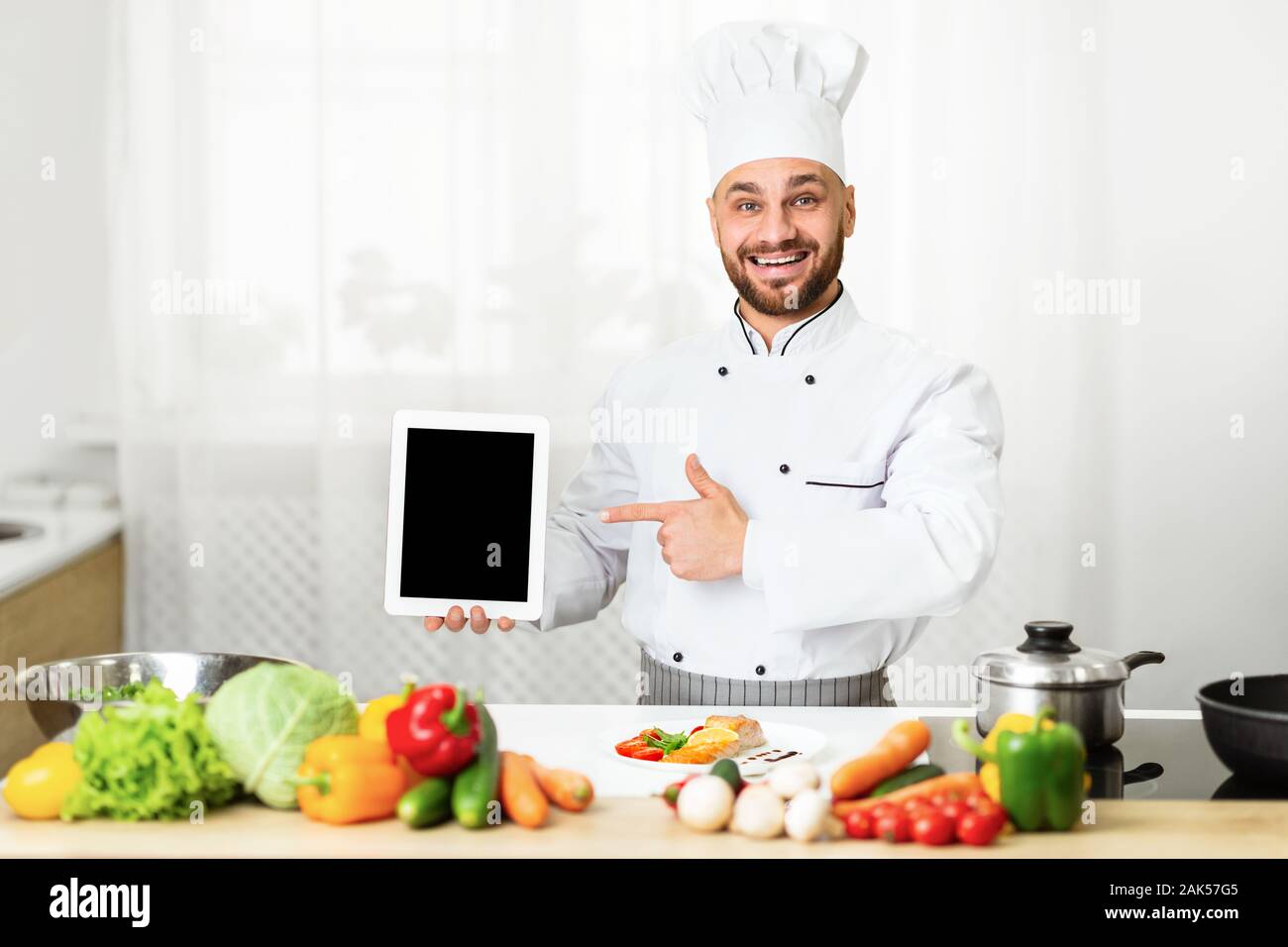 Food Blog. Chef Cook Man Holding Tablet Pointing Finger At Blank Screen ...