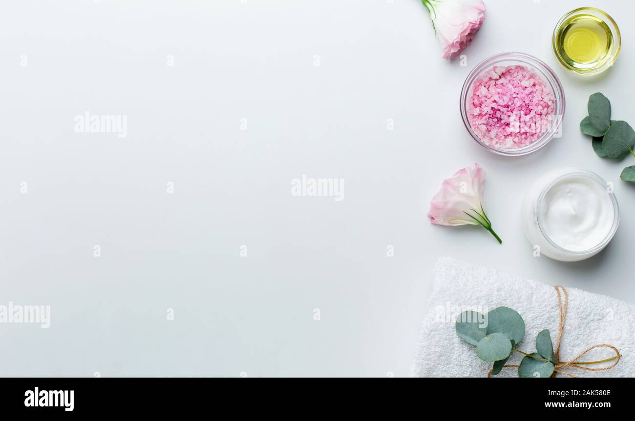 Homemade spa products of pink roses petals on white background, copy ...