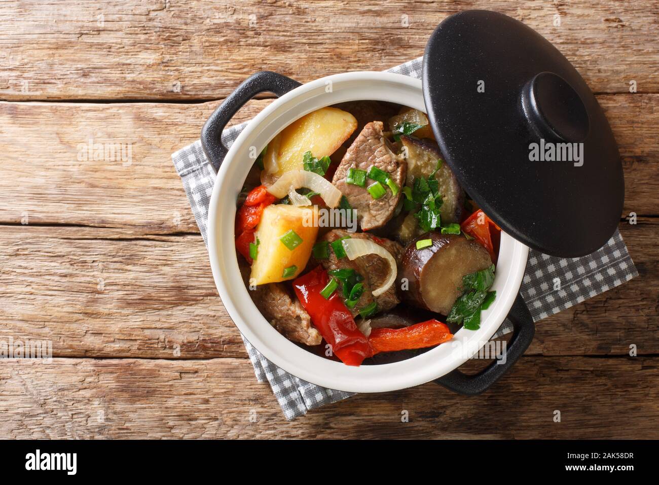 Tasty Georgian Chanakhi stew of meat and vegetables in a pot close-up ...