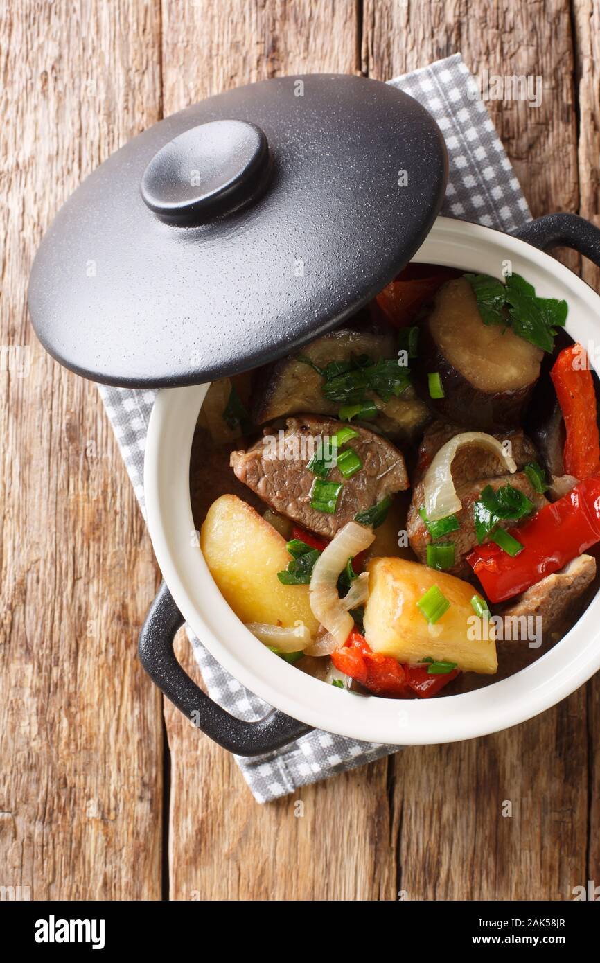 Traditional Georgian meat chanakhi with vegetables in a pot close-up on ...