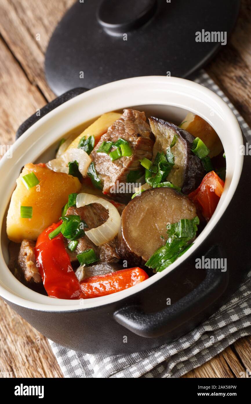 Traditional Georgian meat chanakhi with vegetables in a pot close-up on ...