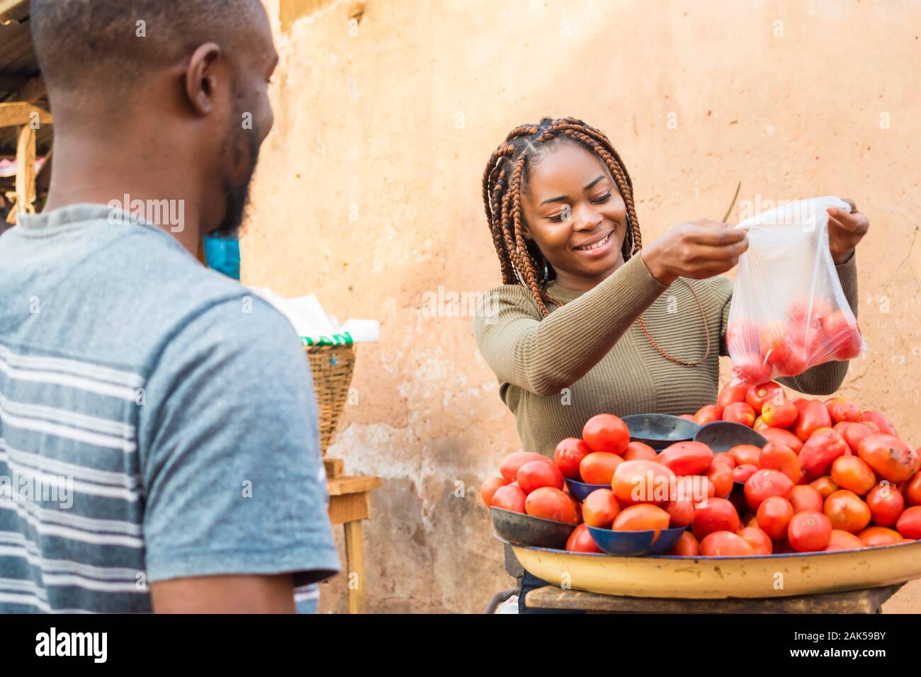 Girl selling food items hi-res stock photography and images - Alamy