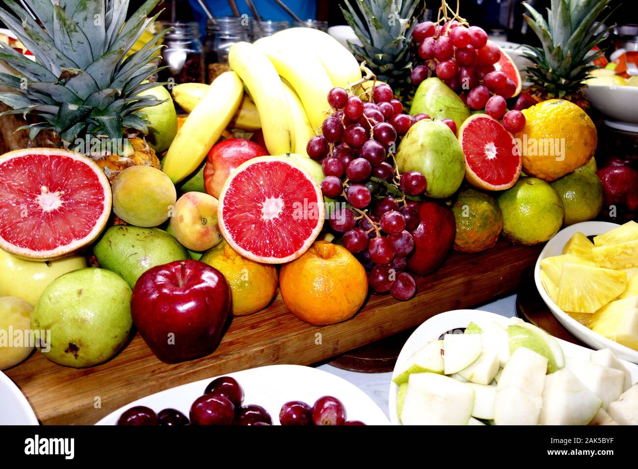 Fresh Fruit on a Wooden Board on Display at the Smoothie Station in the ...