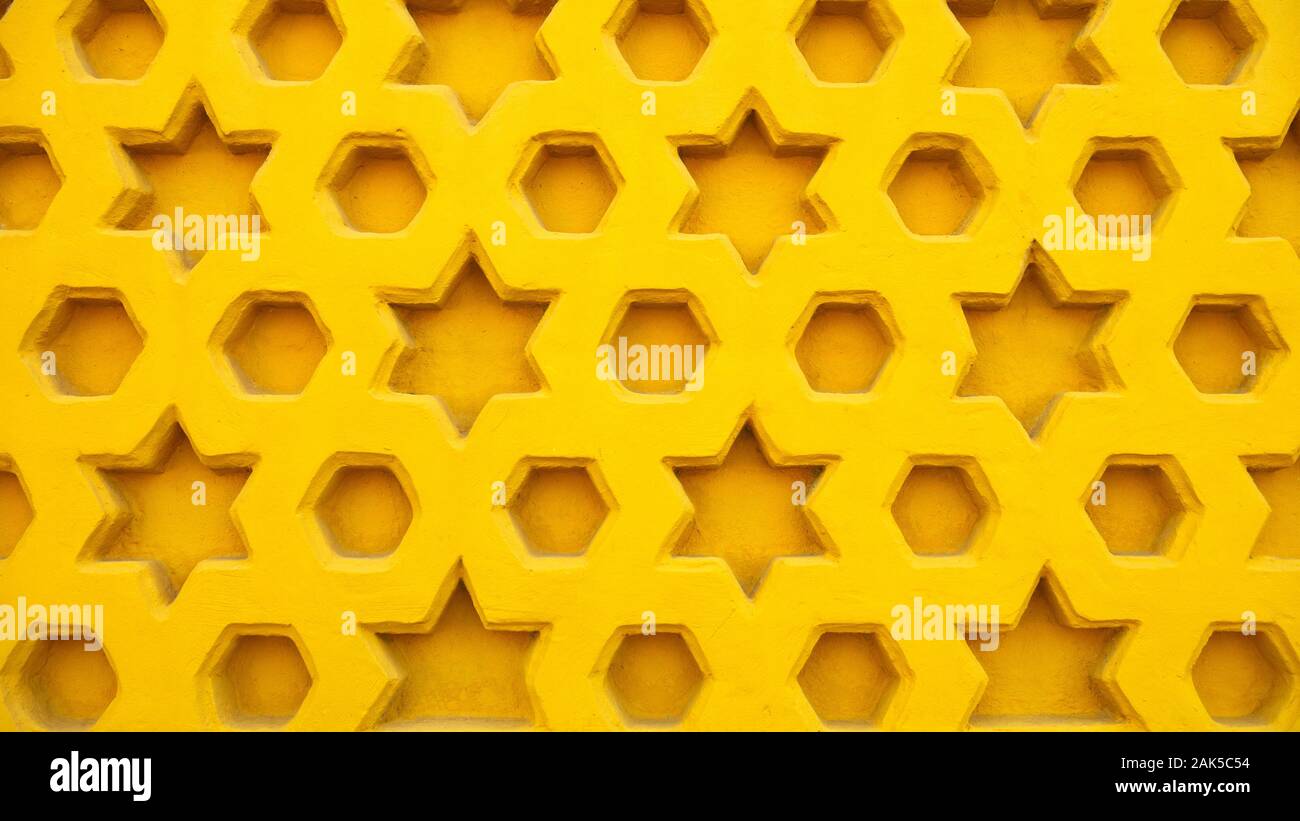 Geometric Islamic ornament on a yellow wall background Stock Photo - Alamy