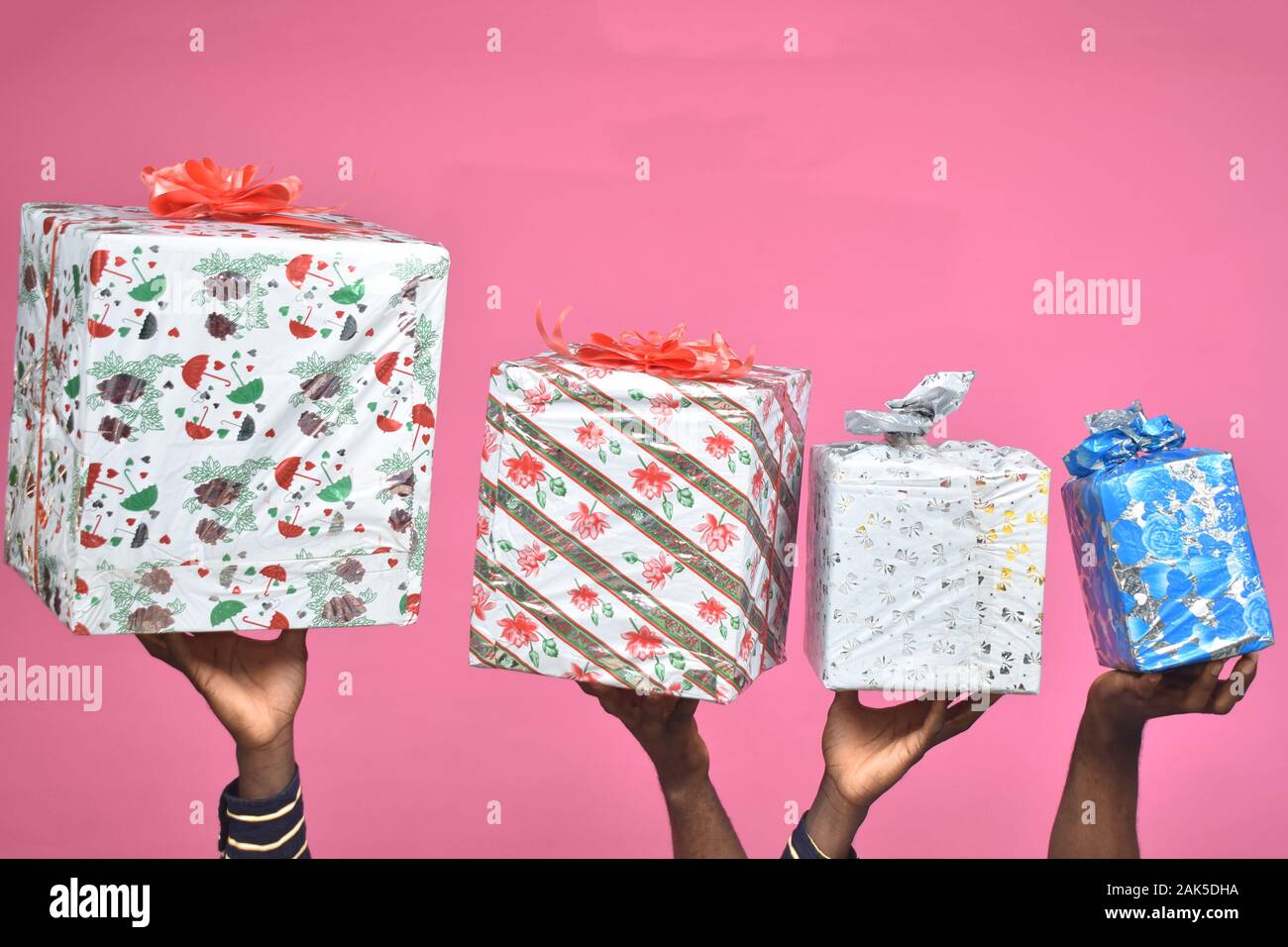 hands lifting up some gift boxes, black people hands only Stock Photo ...
