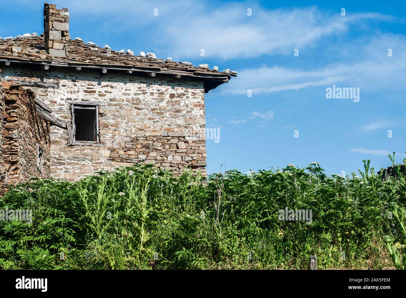 Old rural country stone house facade in sunny summer day Stock Photo ...