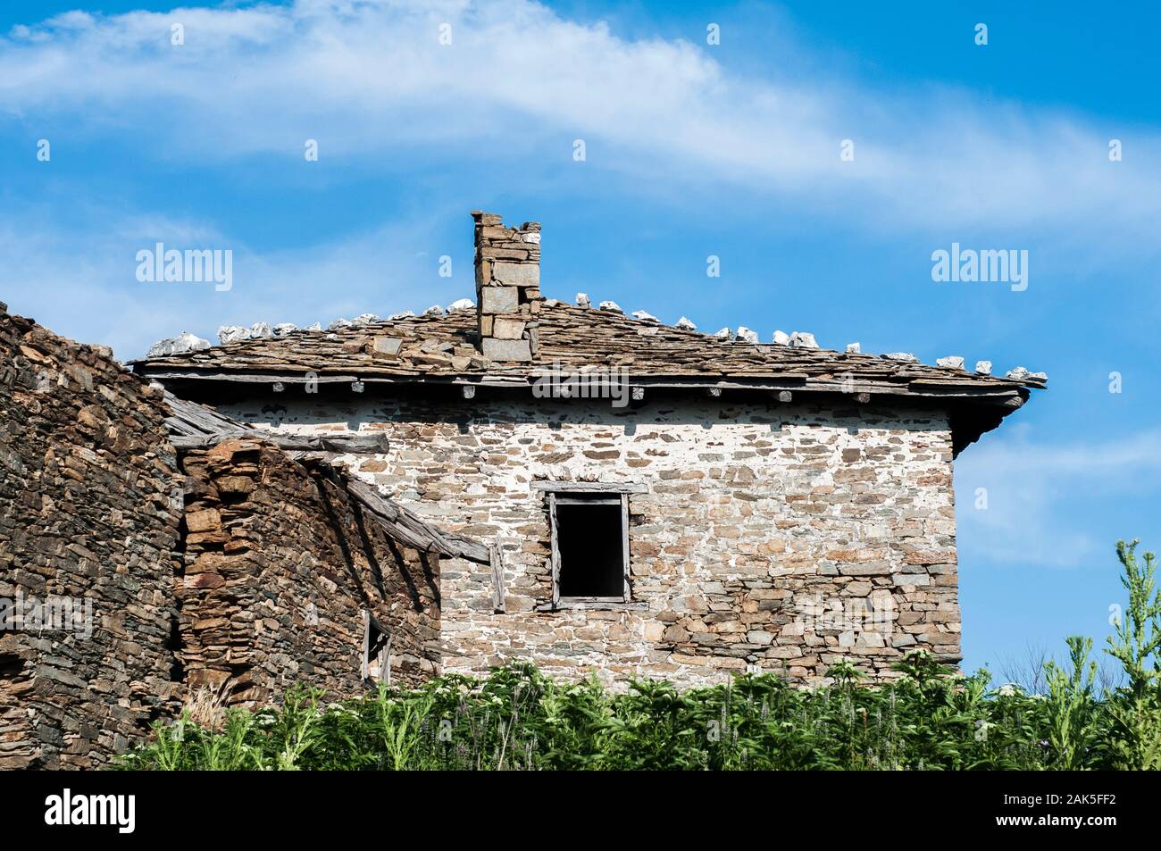 Old rural country stone house facade in sunny summer day Stock Photo ...