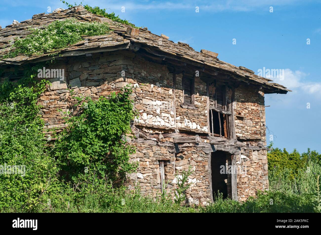 Old rural country stone house facade in sunny summer day Stock Photo ...