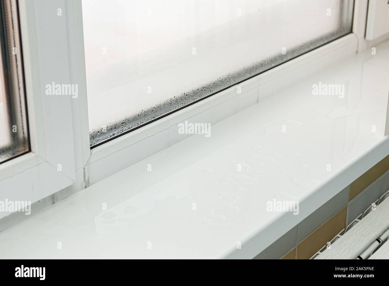 Plastic window with damp and water condensation on glass. Bad ...