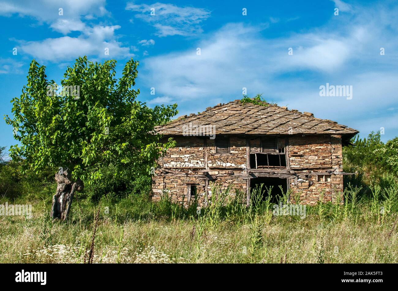Old rural country stone house facade in sunny summer day Stock Photo ...