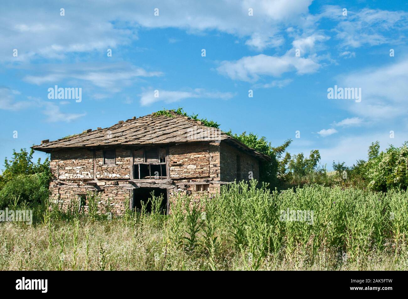 Old rural country stone house facade in sunny summer day Stock Photo ...