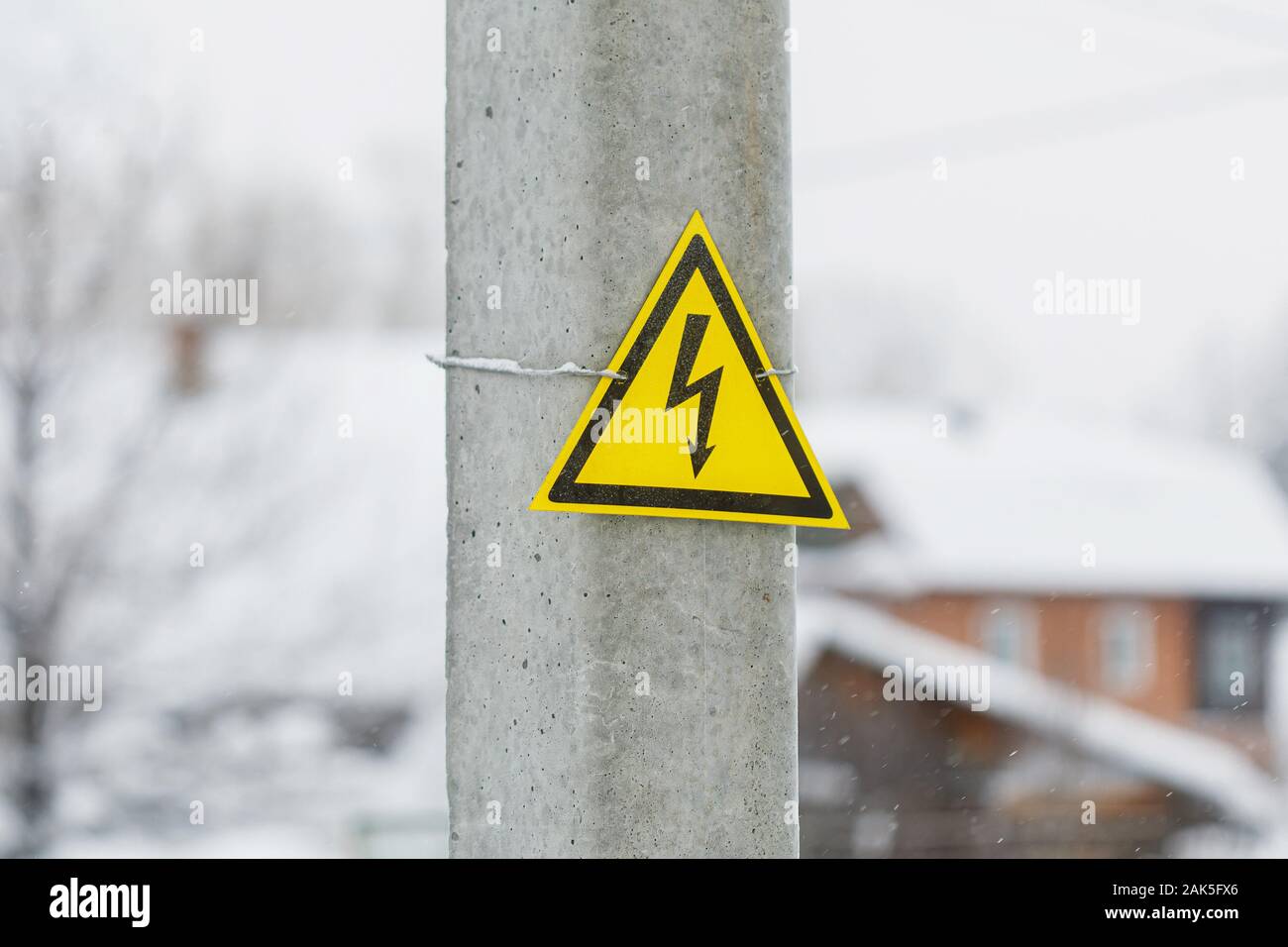 Danger high voltage warning sign with yellow triangle and lightning ...